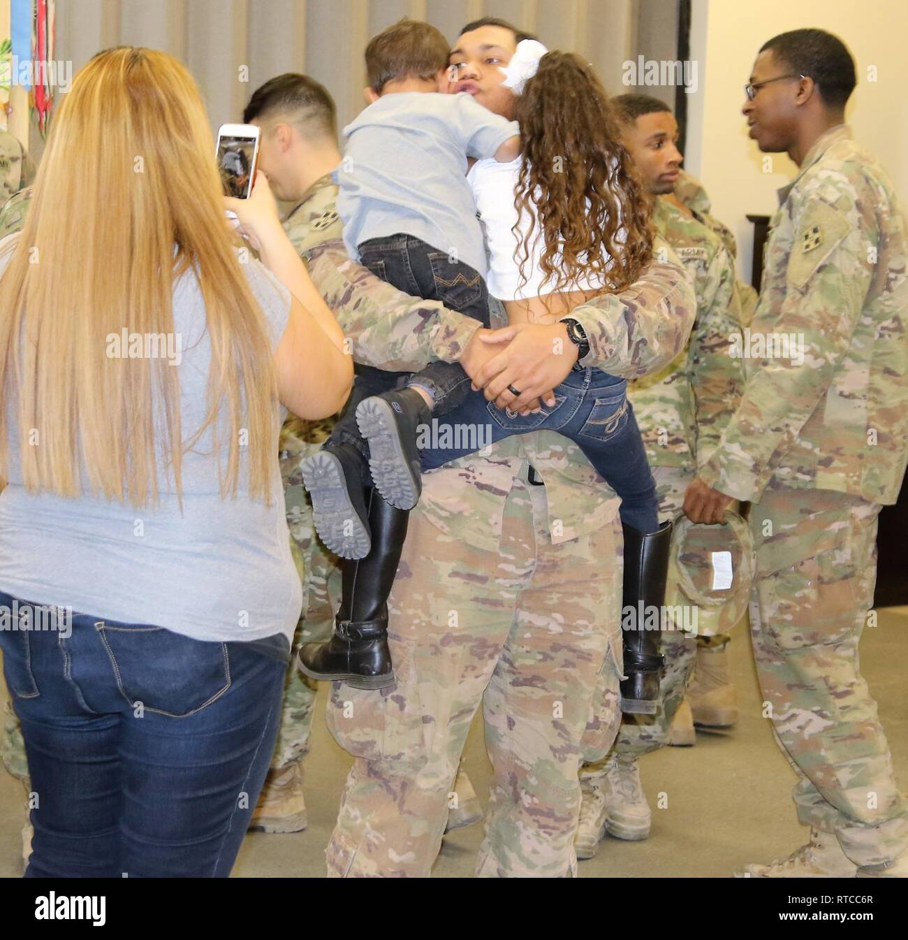 Family members welcome home soldiers from 60th Ordinance, 68th Combat ...