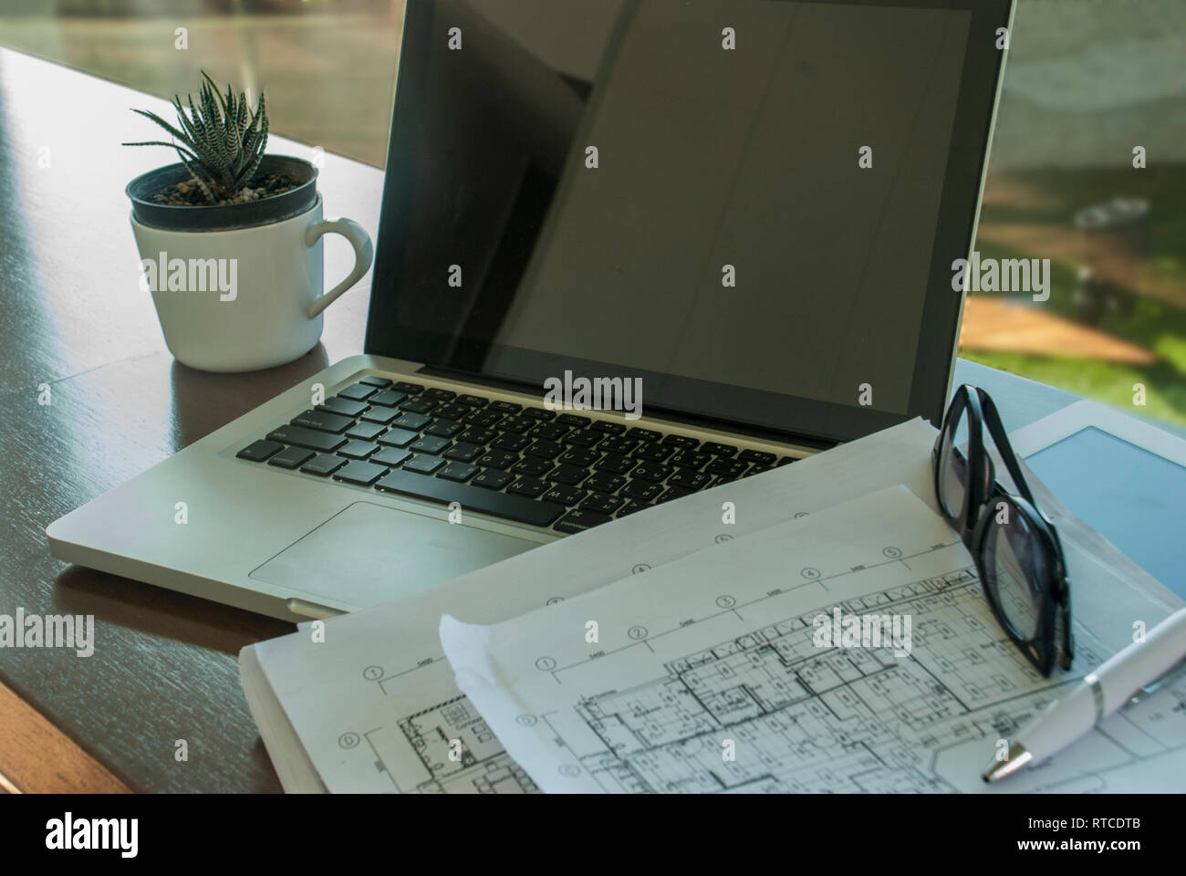 Work area with laptops and communication devices, including work ...