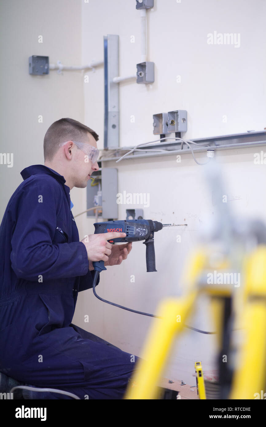 students at a further education college learning how to become an ...