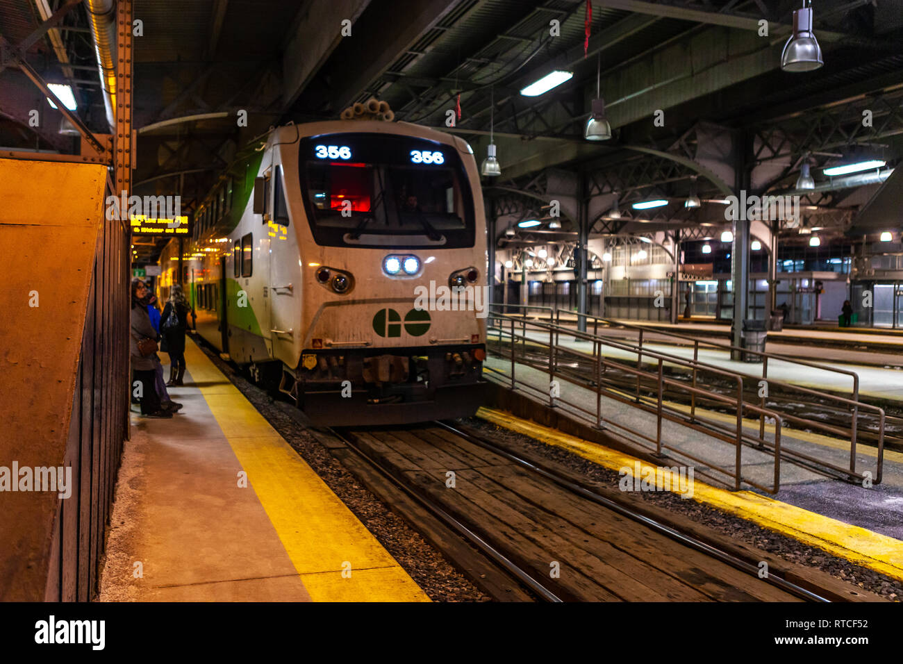 Green wagons of speed Toronto’s GO train at Platform of Union Station ...