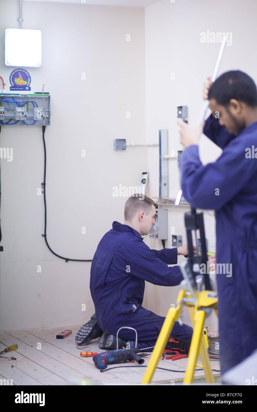 students at a further education college learning how to become an ...