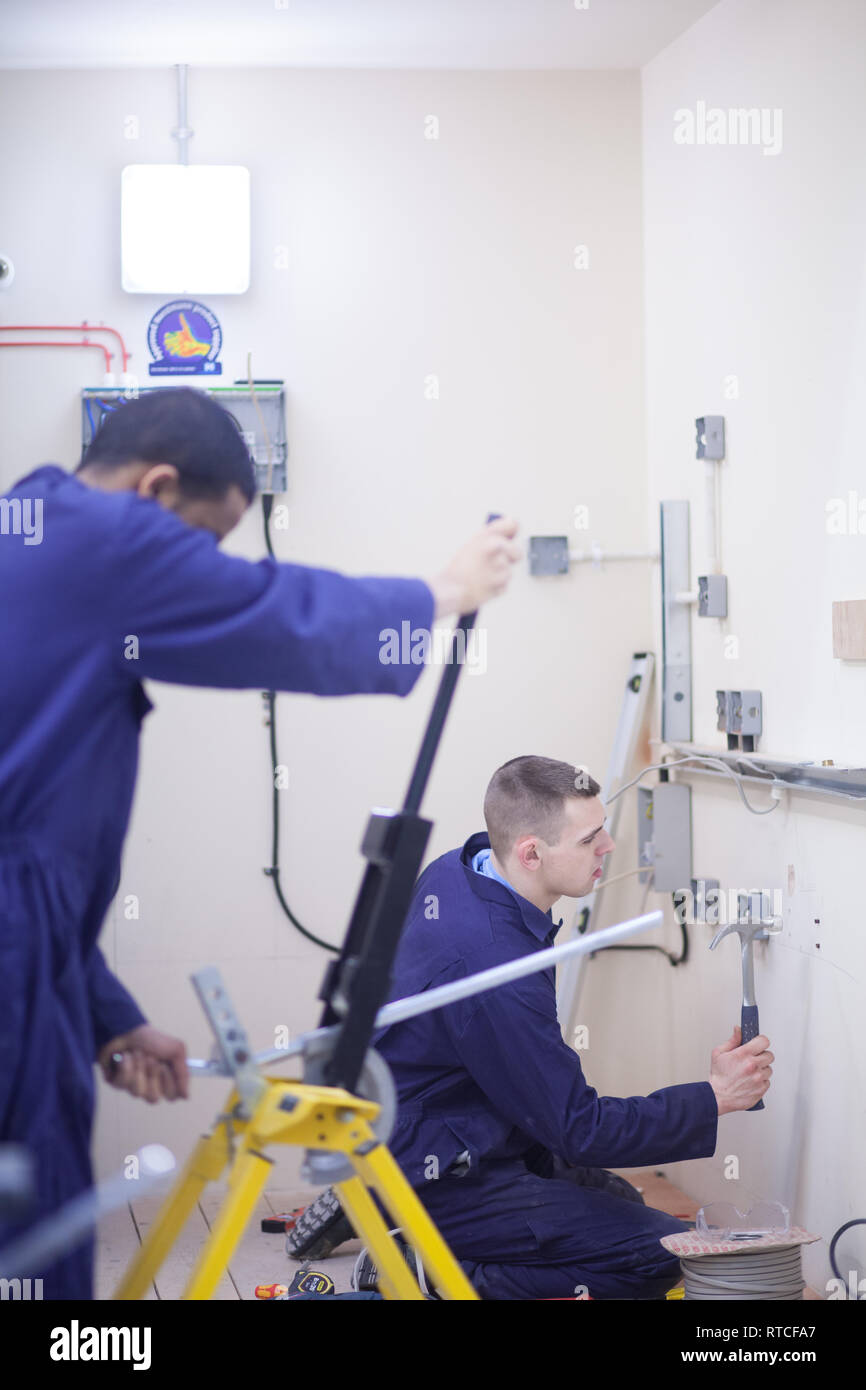 students at a further education college learning how to become an ...