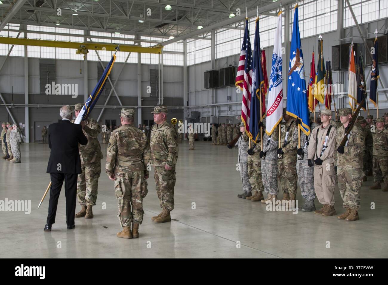 U.S. Army Maj. Gen. Van McCarty receives the colors from Gov. Henry ...