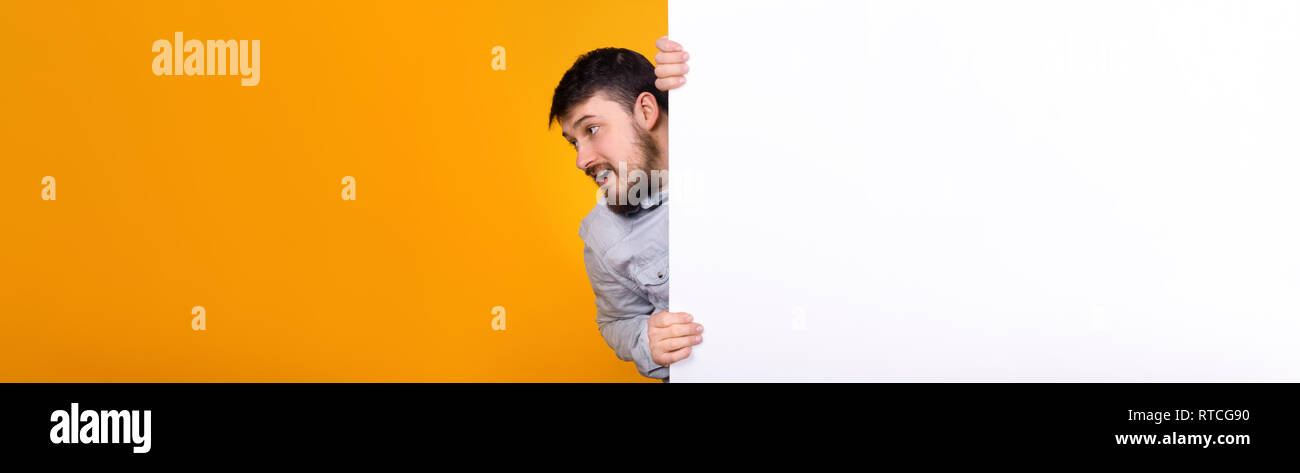 bearded man pulls banner with place for text, concept space for your ...