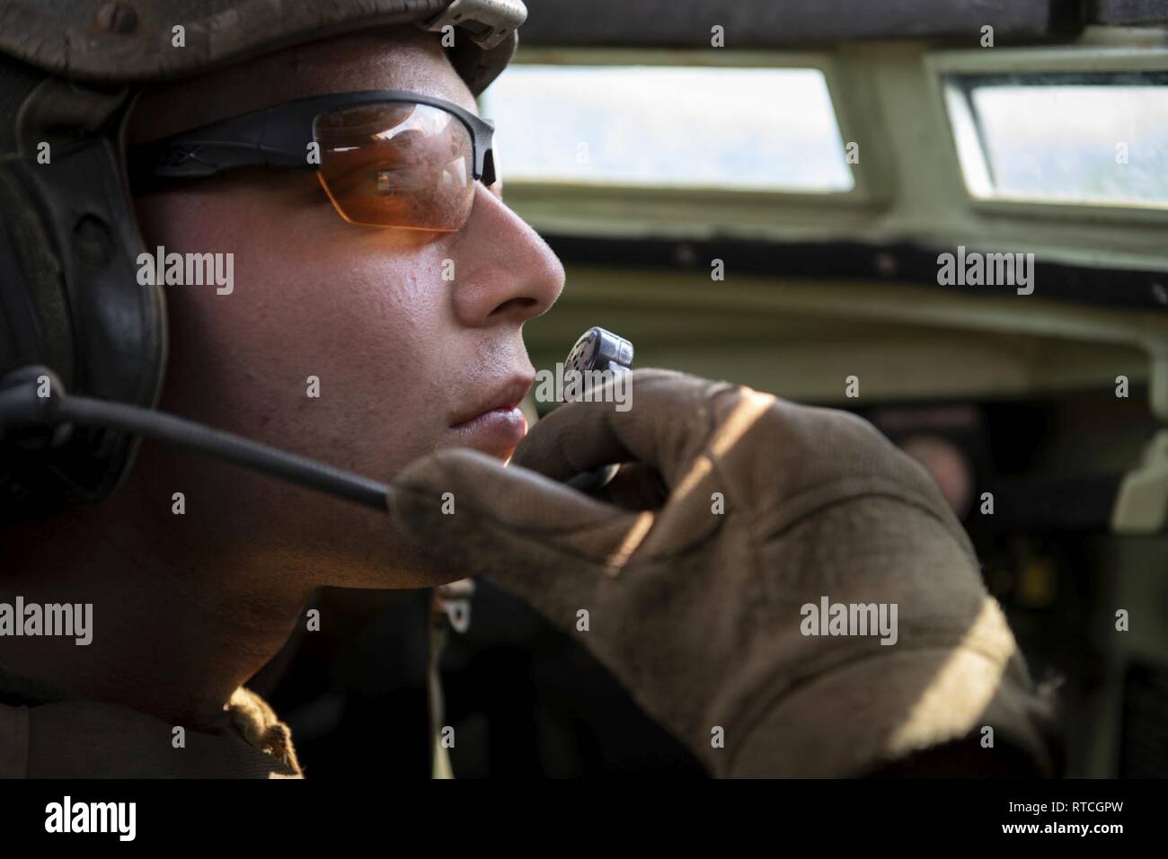 U.S. Marine Corps Lance Cpl. Benjamin Reed waits for commands from the ...