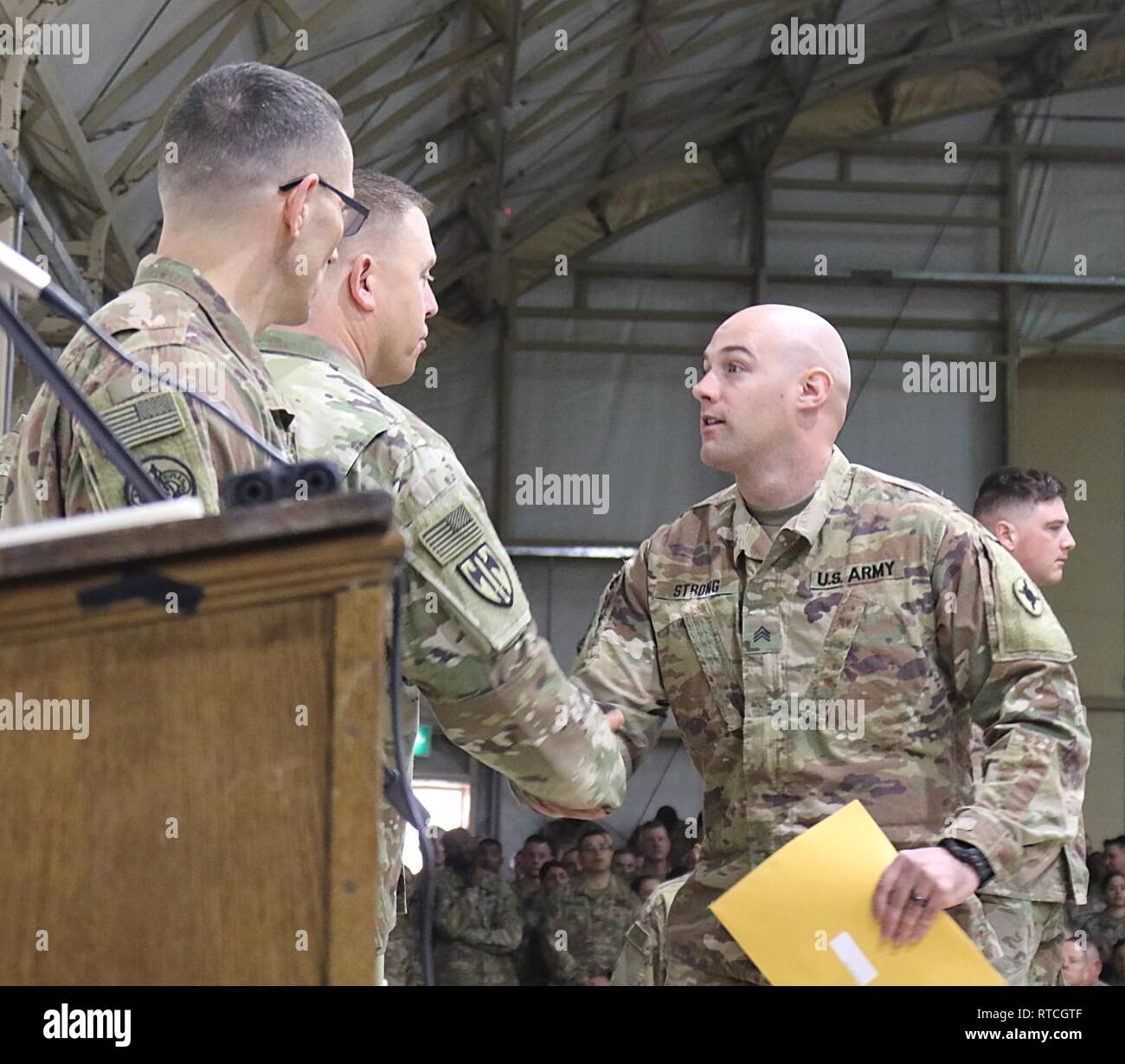 Sgt. Tyler Strong, 184th Sustainment Command, receives his certificate ...