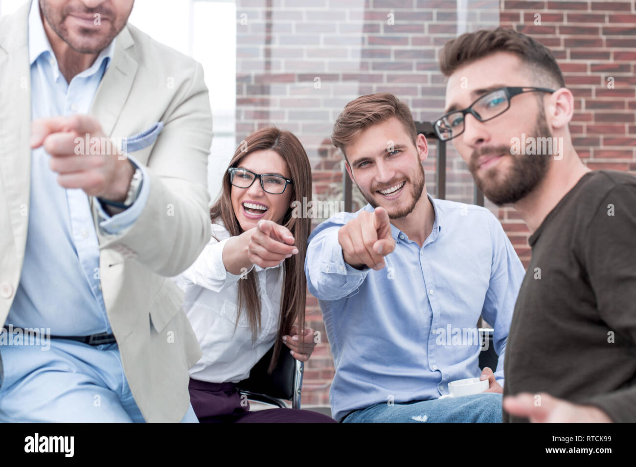 group of employees pointing their fingers at you Stock Photo - Alamy