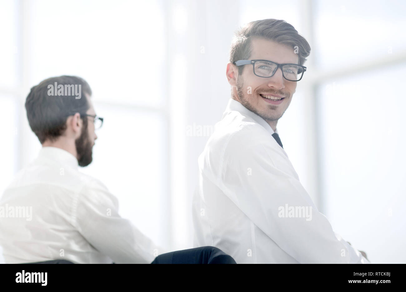 rear view.employees in the workplace Stock Photo - Alamy