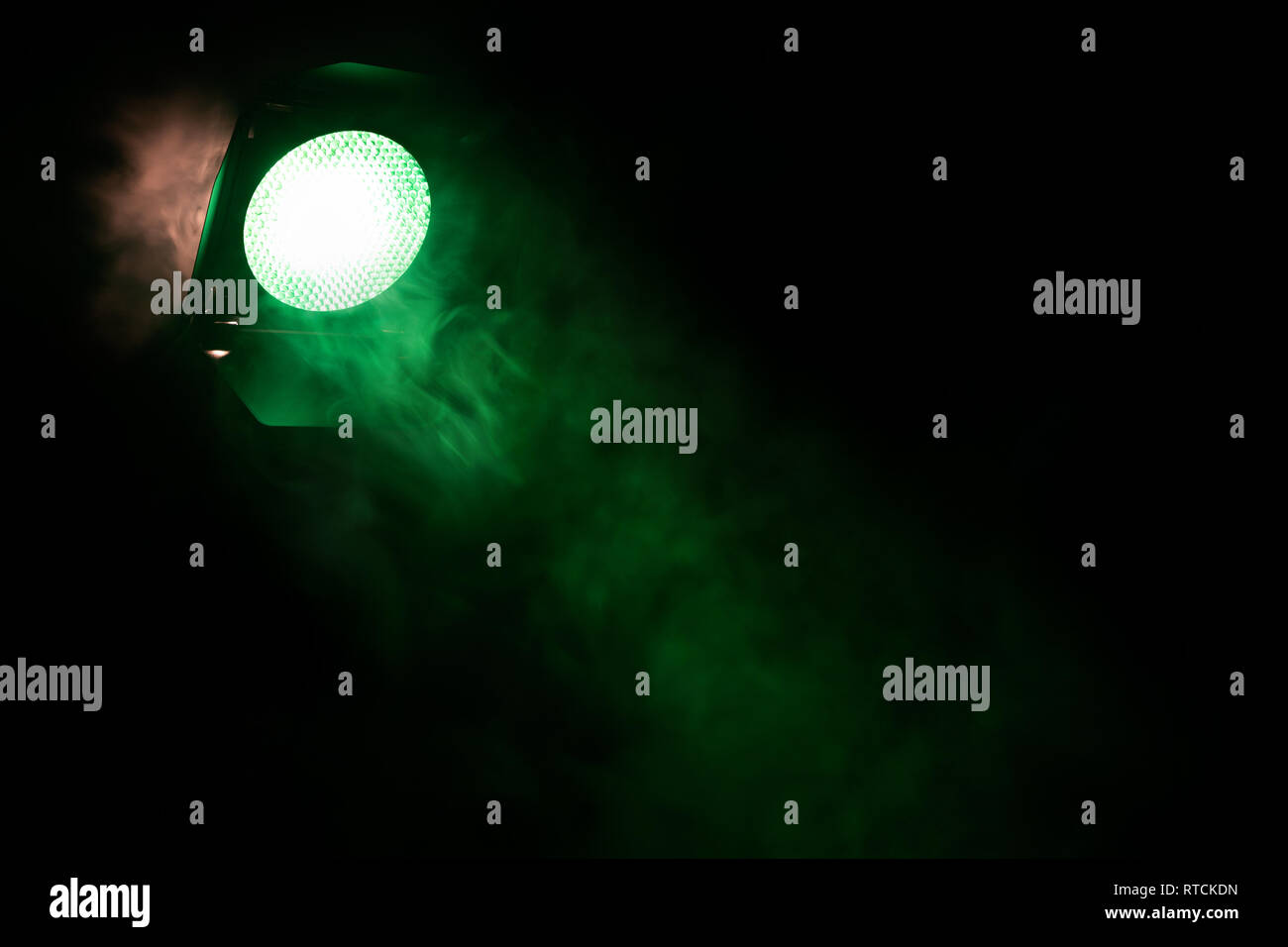 Green light with smoke on dark background. Equipment for photo Studio ...