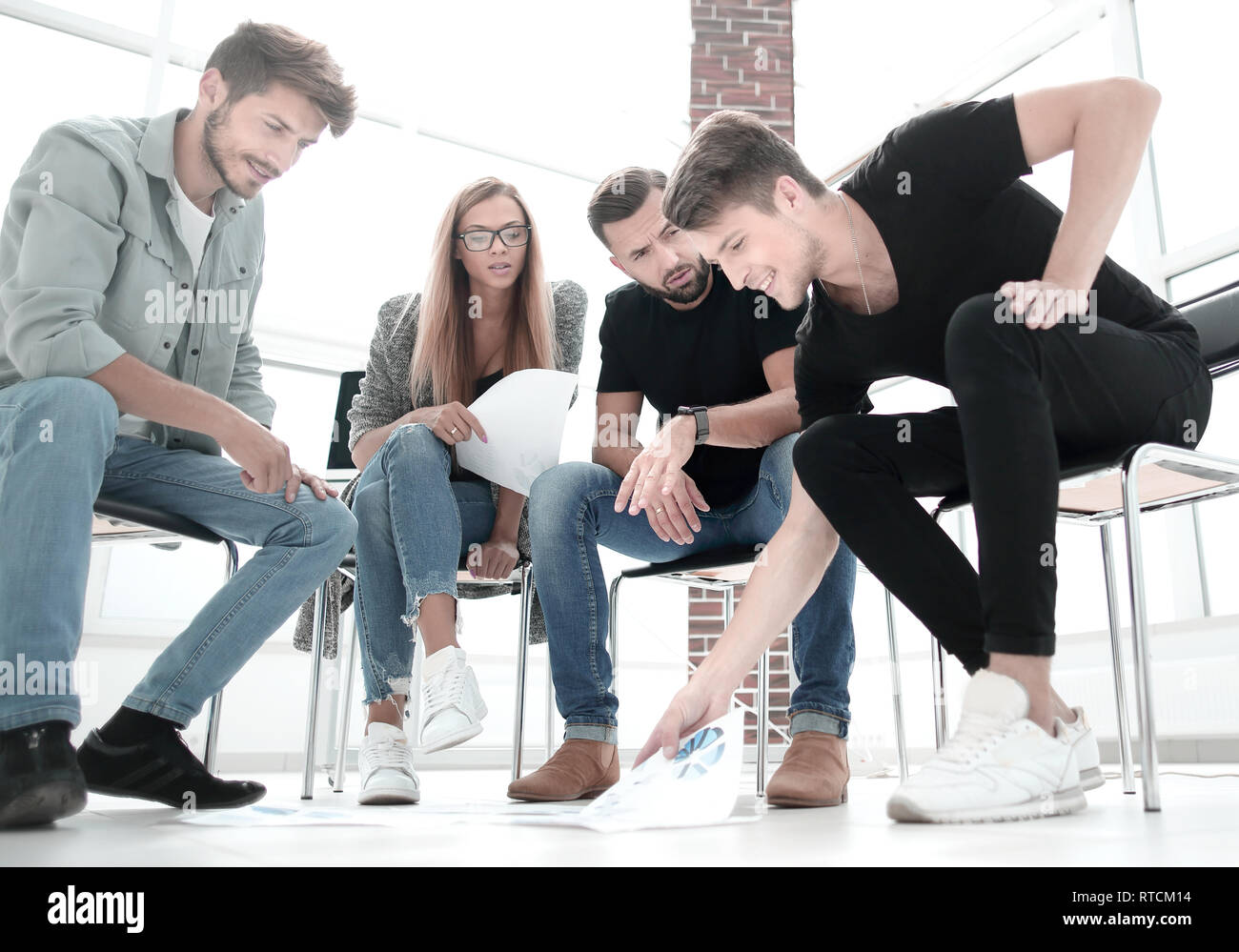 Business office team passing documents hi-res stock photography and ...