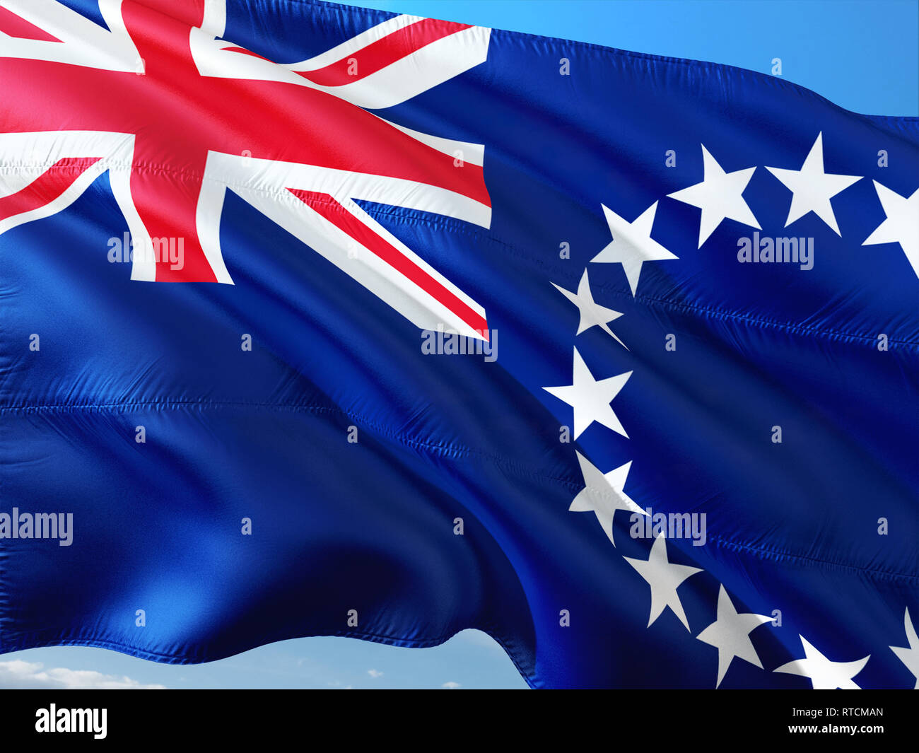Flag of Cook Islands waving in the wind against deep blue sky. High ...