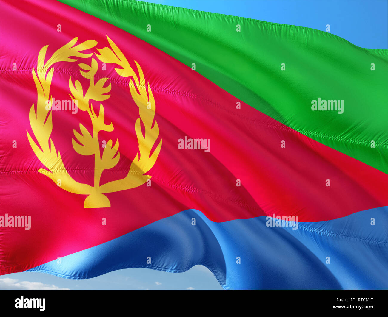 Flag of Eritrea waving in the wind against deep blue sky. High quality ...