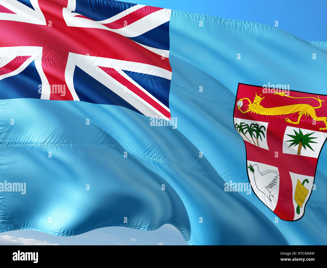 Flag of Fiji waving in the wind against deep blue sky. High quality ...