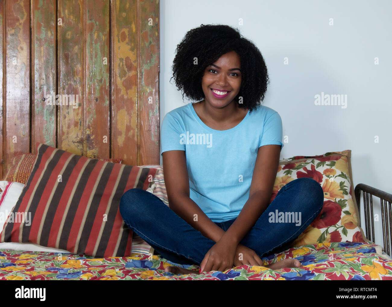 Beautiful african american woman relaxing indoor at home Stock Photo ...