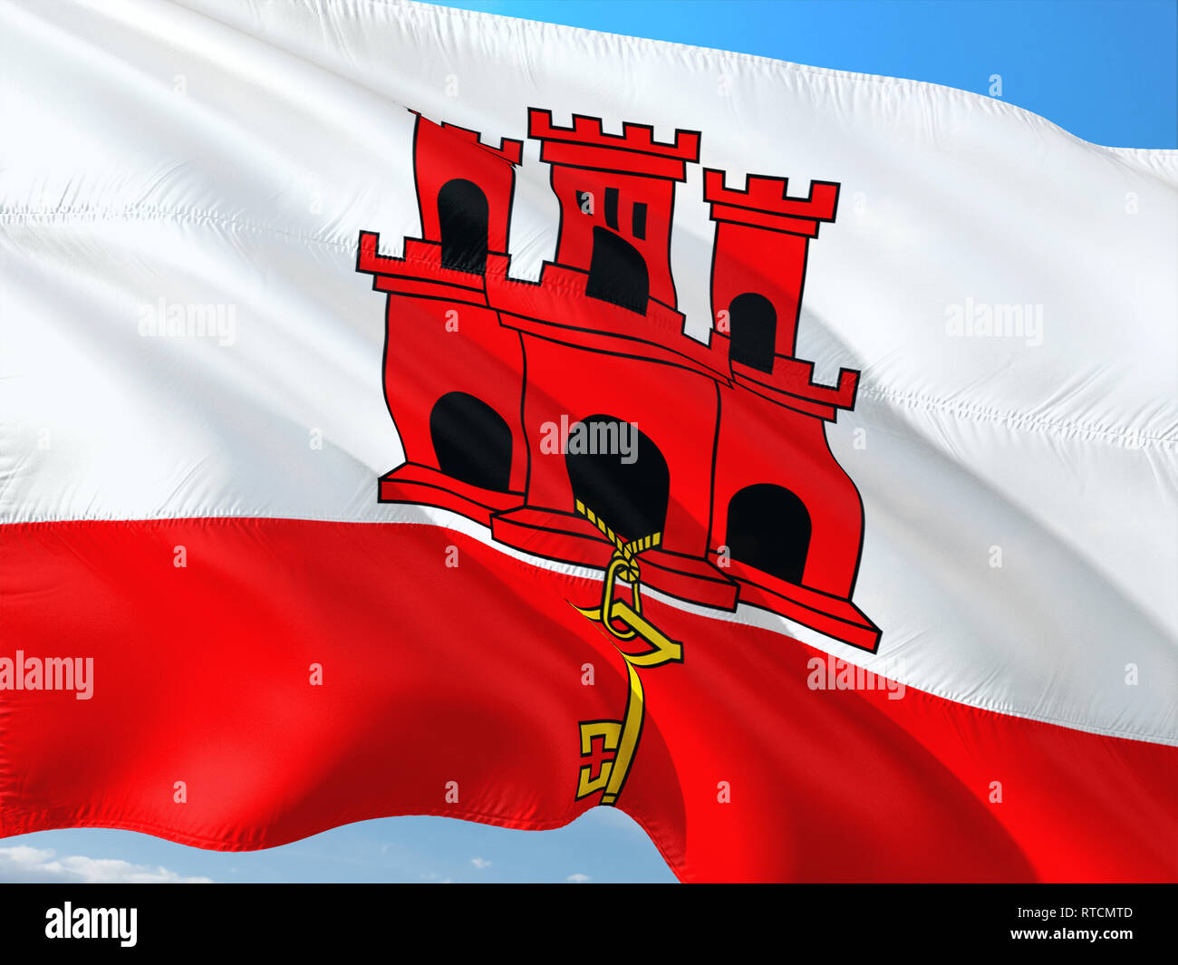 Flag of Gibraltar waving in the wind against deep blue sky. High ...