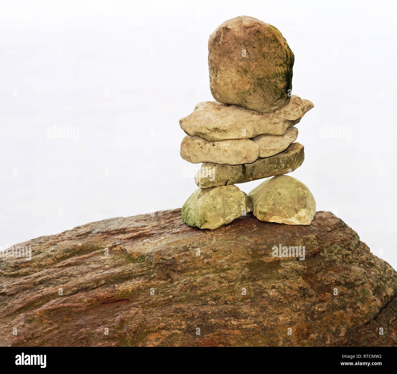 Stones balancing one upon another creating an Inukshuk Stock Photo - Alamy
