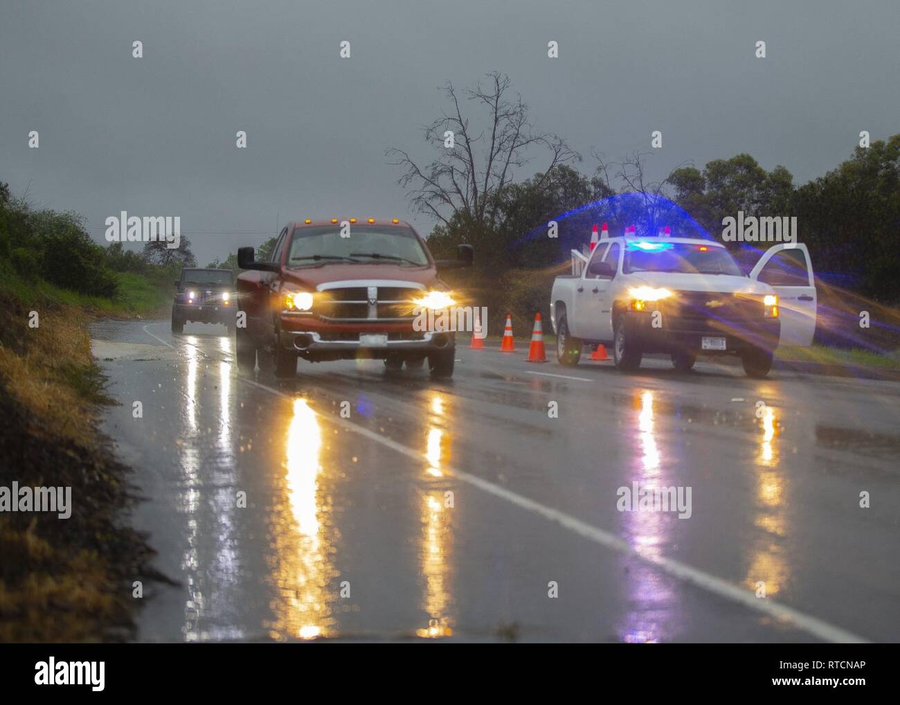 An emergency vehicle with the Provost Marshal's Office monitors a lane ...