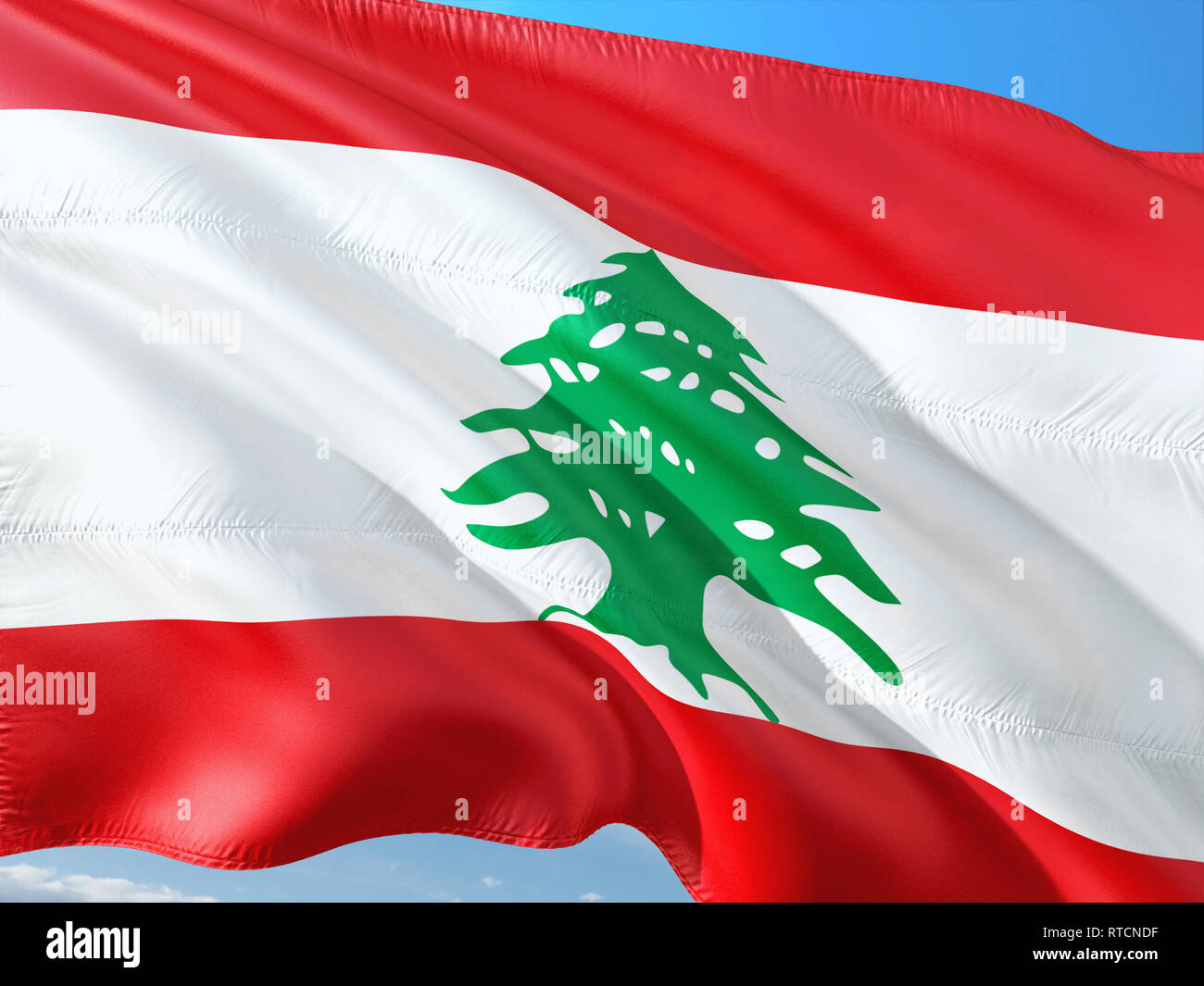 Flag of Lebanon waving in the wind against deep blue sky. High quality ...