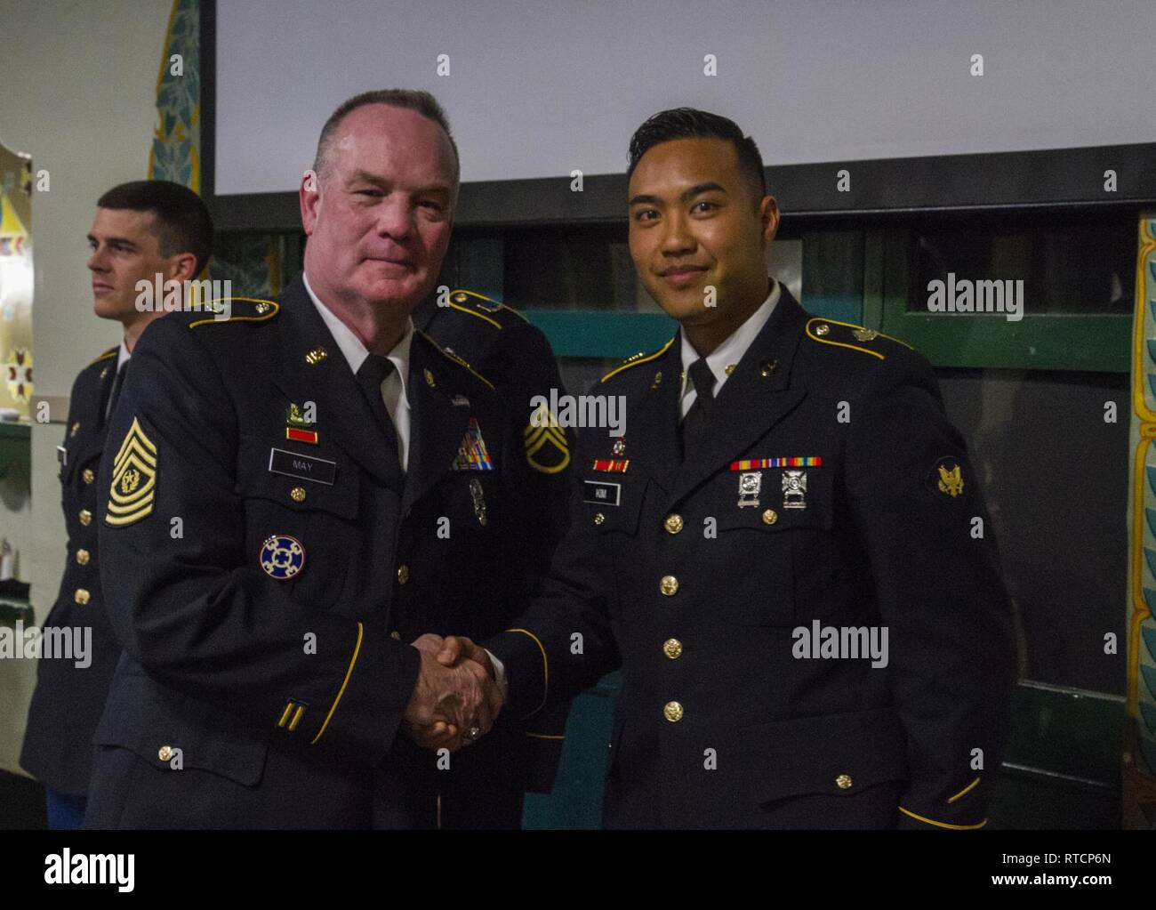 U.S. Army Command Sgt. Major Lawrence May (left), Command Sgt. Maj. 91st Training Division ...