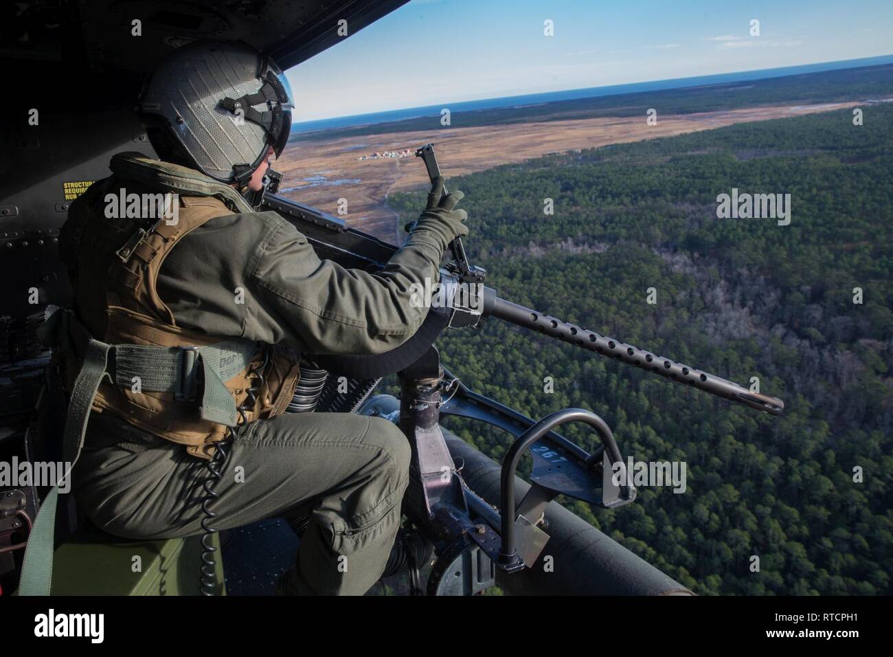 U.S. Marine Lance Cpl. Matthew Dowler clears a GAU-21 .50 caliber ...