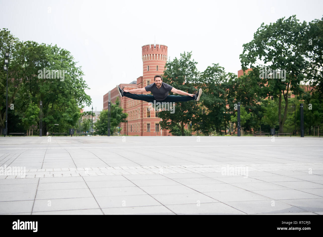 dance, sport, fitness. man jumping russian split Stock Photo - Alamy