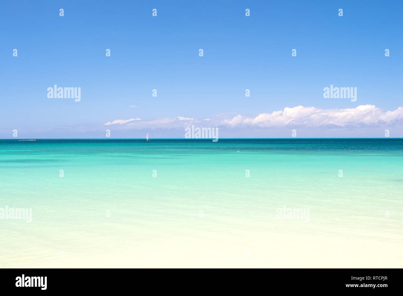 sea. Beautiful white clouds on blue sky over calm sea with sunlight ...