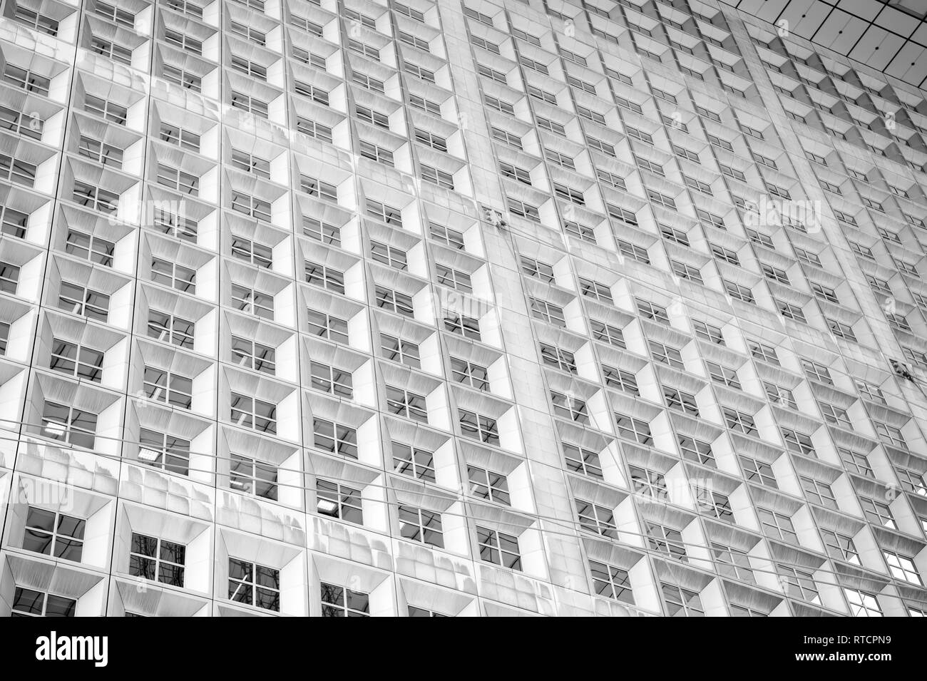 perspective wide angle view to steel blue background of glass high rise ...