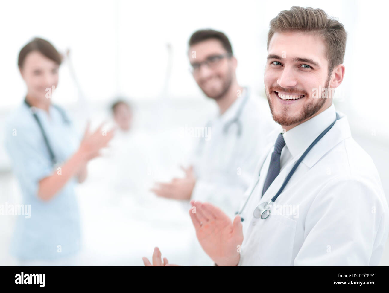 Doctors clapping hands and applauding on consent Stock Photo - Alamy