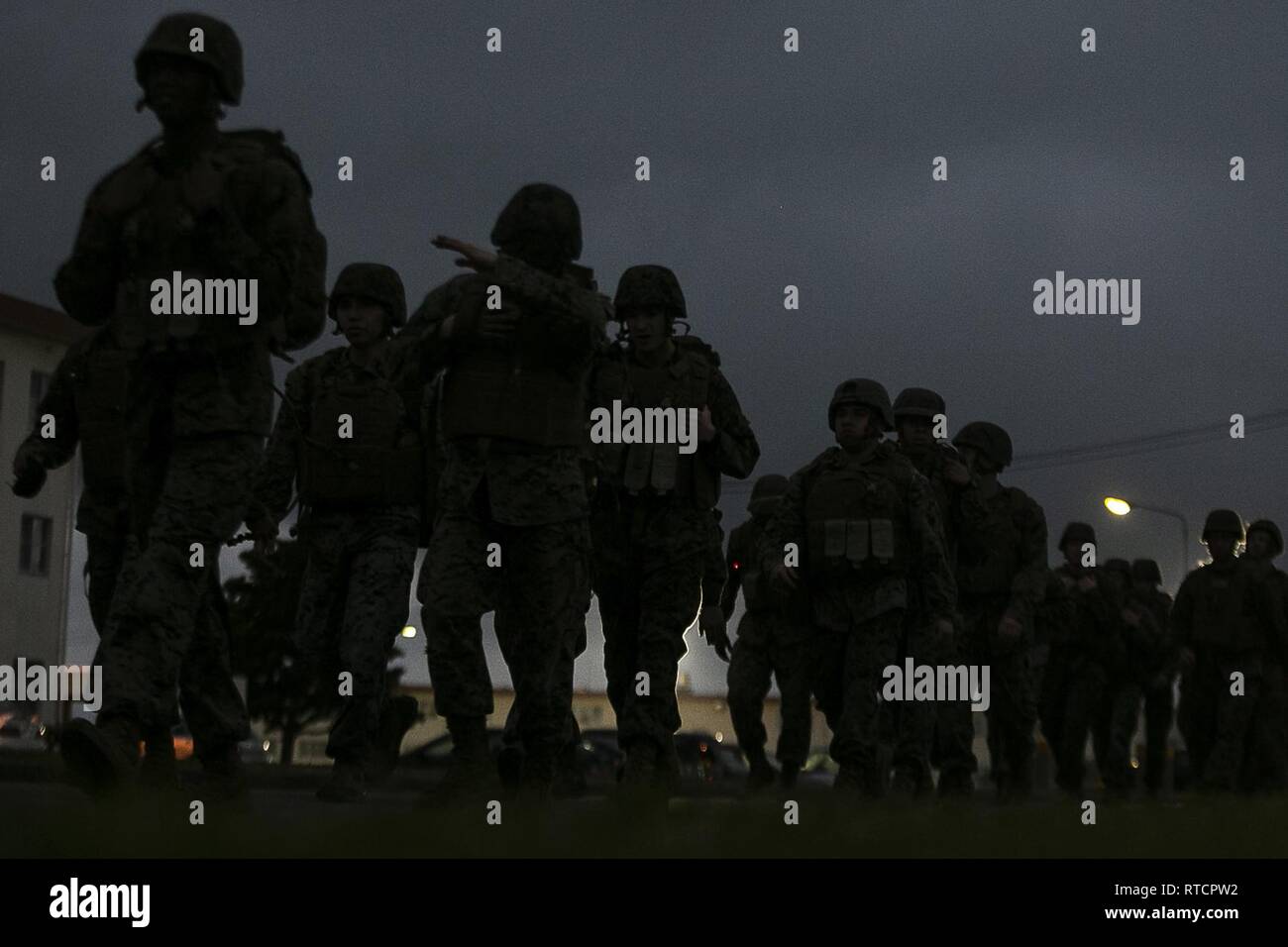 Marines and Sailors with the 31st Marine Expeditionary Unit march in ...