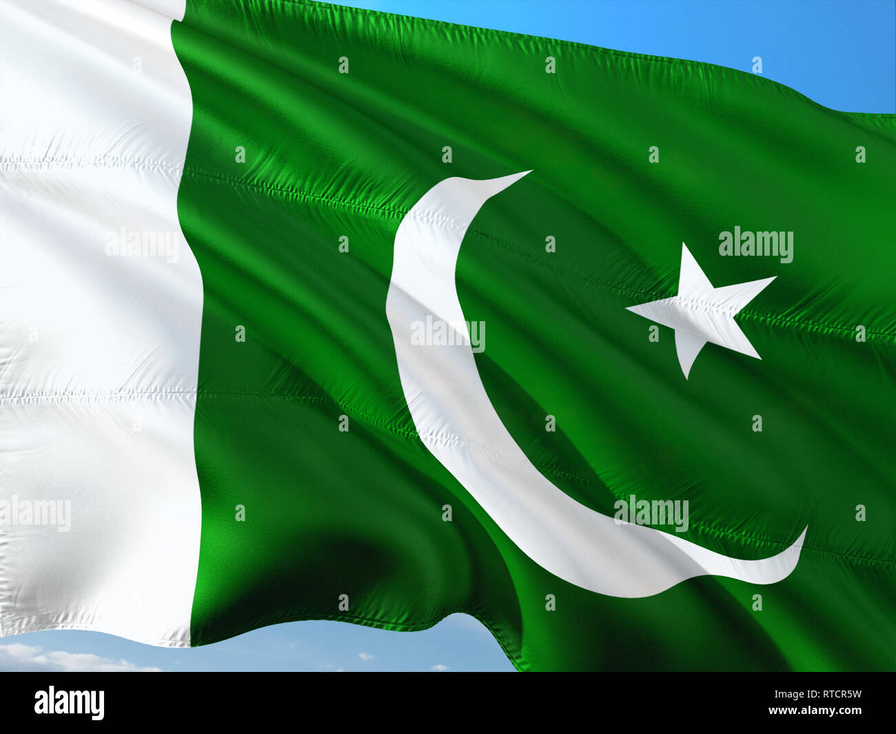 Flag of Pakistan waving in the wind against deep blue sky. High quality ...