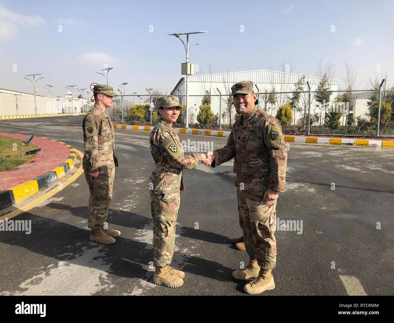 Sgt. Kayla Baker, 657th Movement Control Team, receives a coin for ...