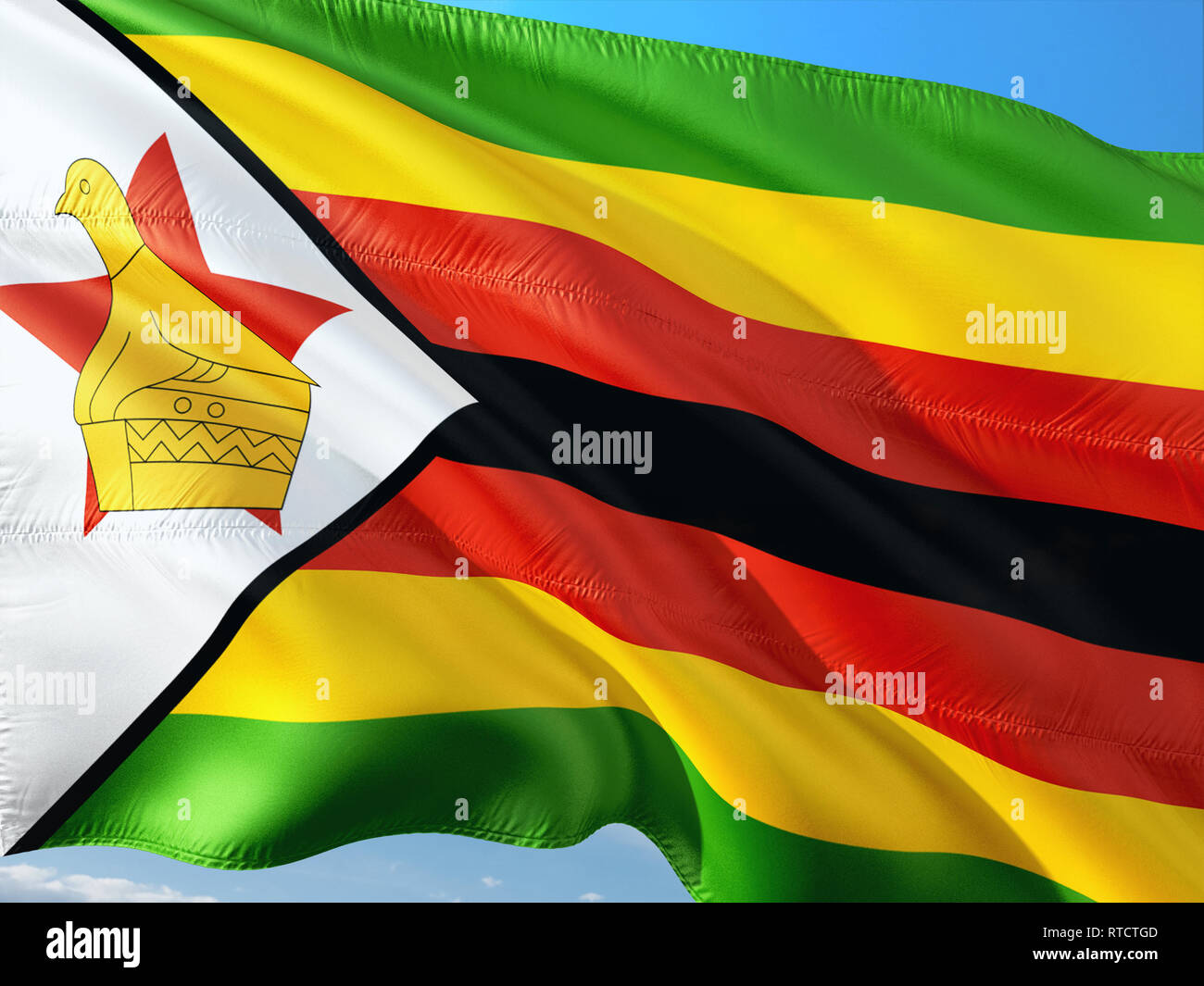 Flag of Zimbabwe waving in the wind against deep blue sky. High quality ...