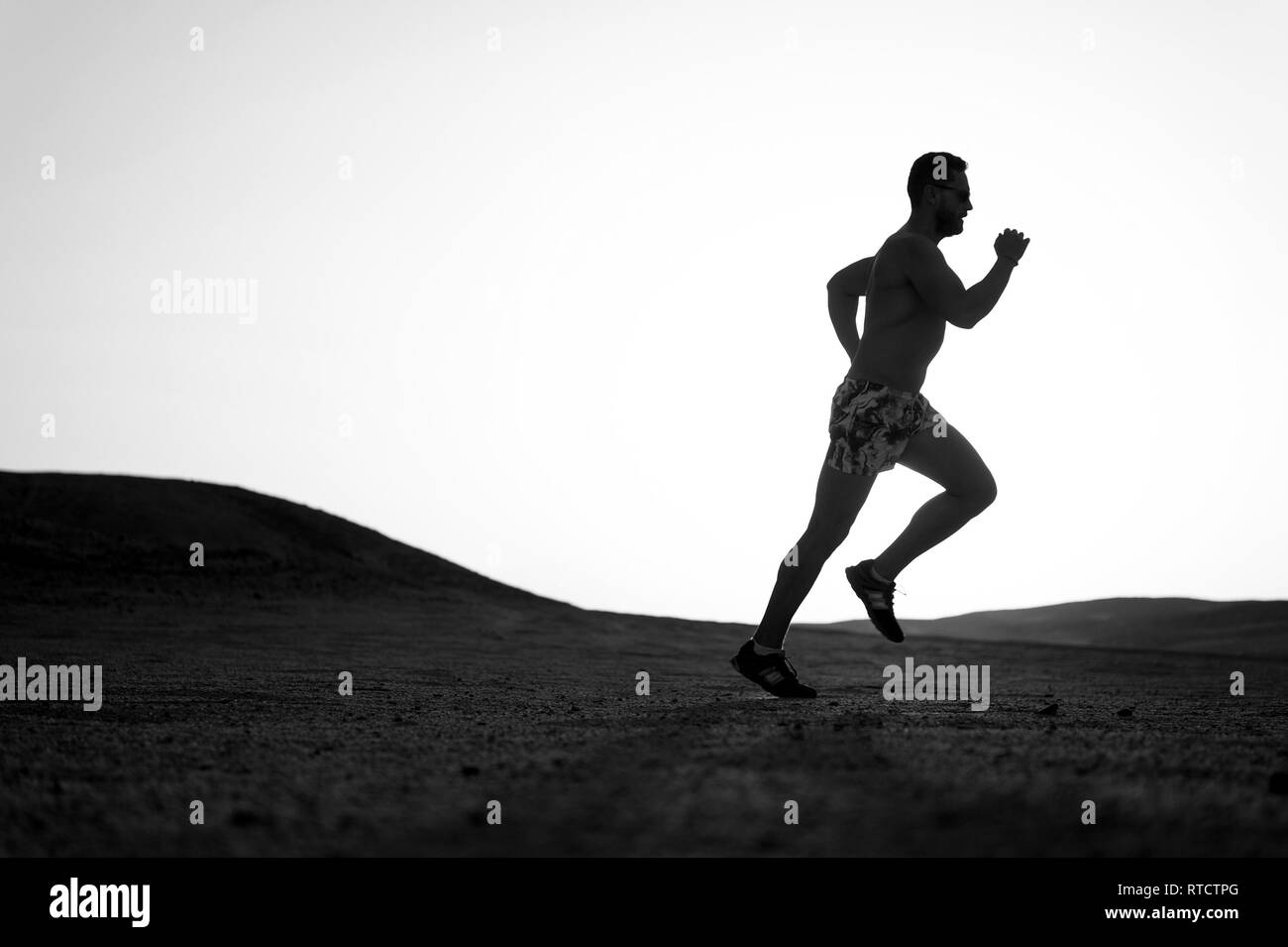running man on mountain nature landscape on sky background in summer or ...