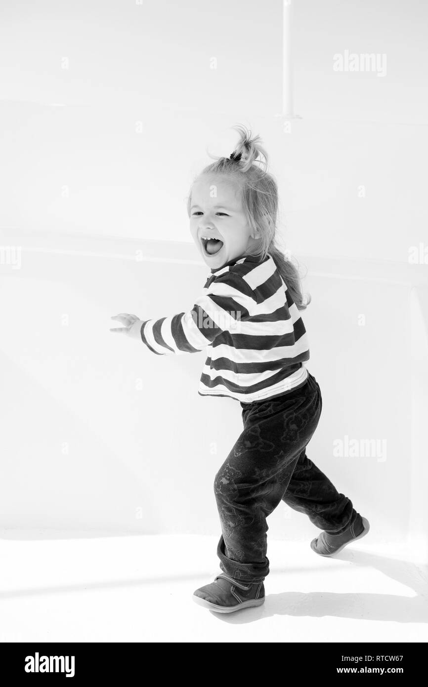 happy cute little baby captain on boat or sailing yacht on summer ...