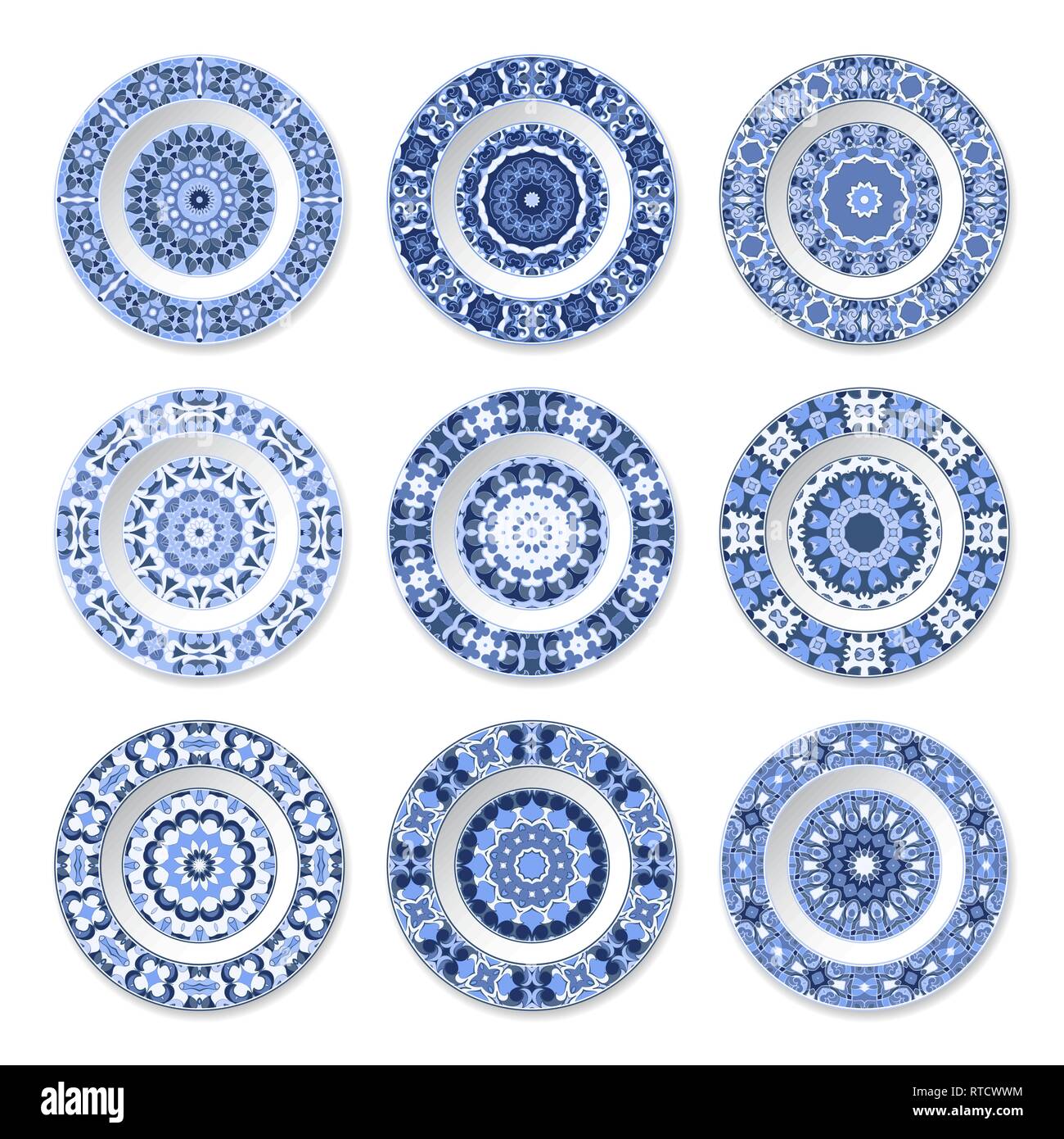 Set of decorative plates with a circular blue pattern, top view. White ...