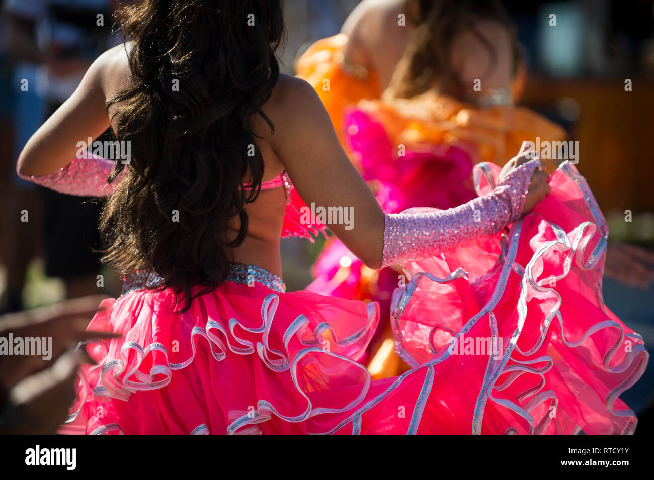 Sunny close-up of the colorful ruffled dresses of Carnival costumes ...