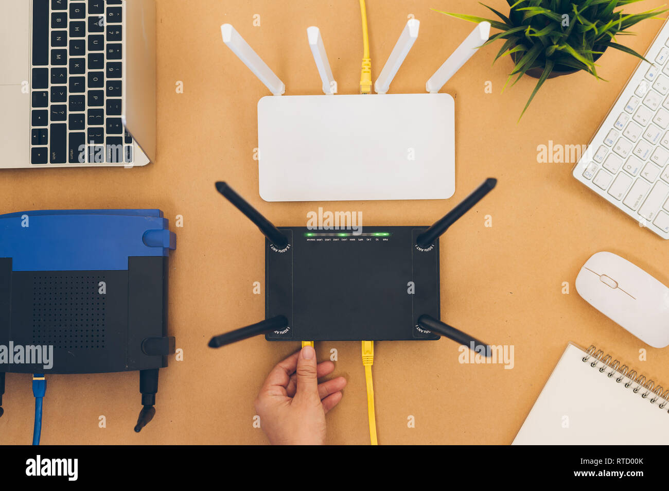 flat lay Office table with wifi router, computer and supplies top view ...