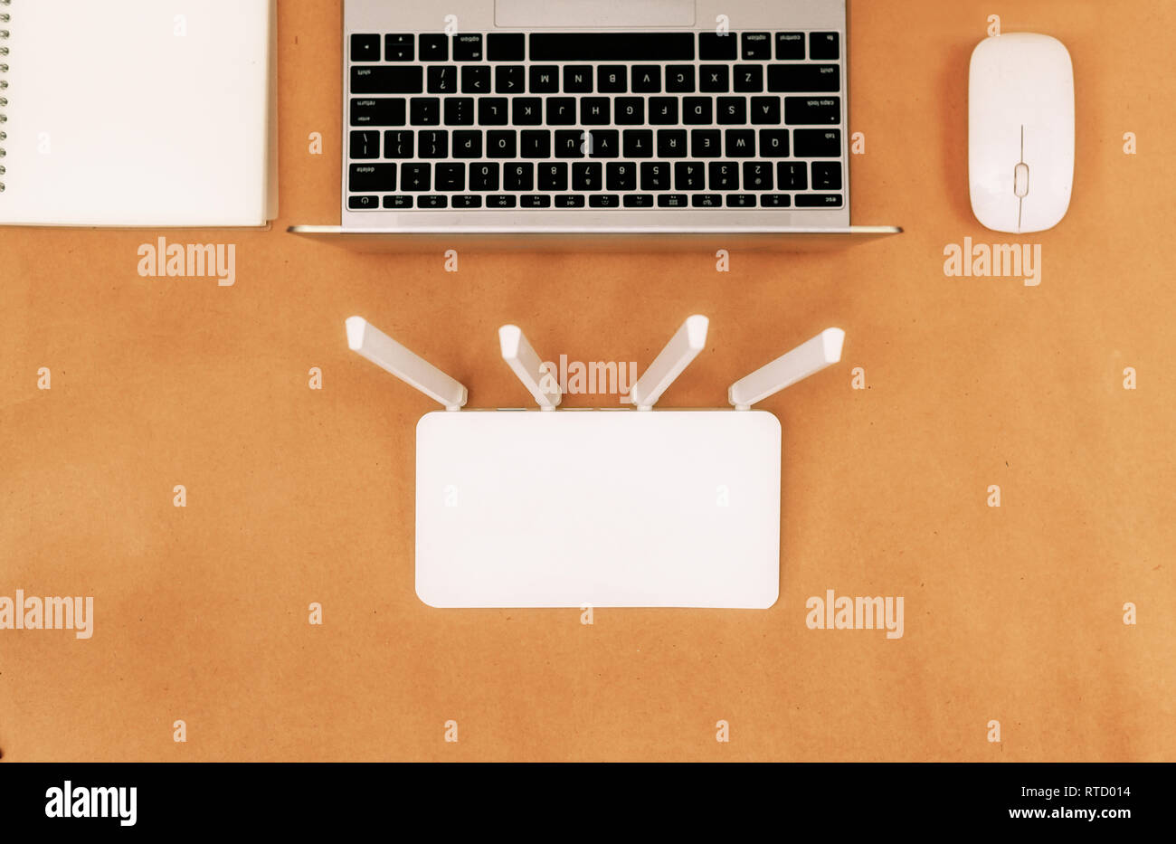 flat lay Office table with wifi router, computer and supplies top view ...