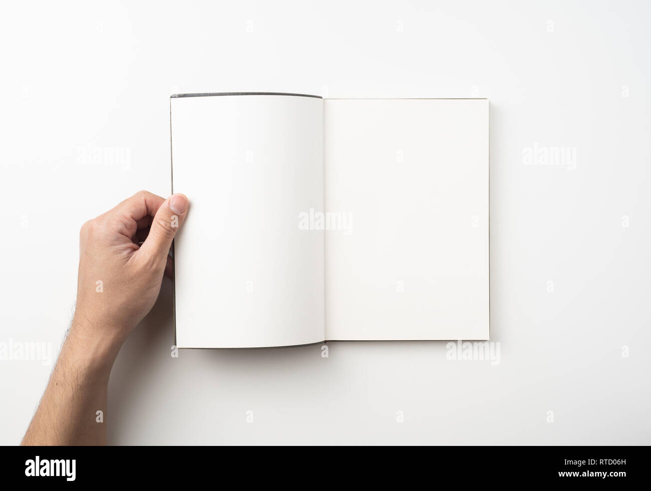 Design concept - Top view of man's hand hold high grade brown notebook ...