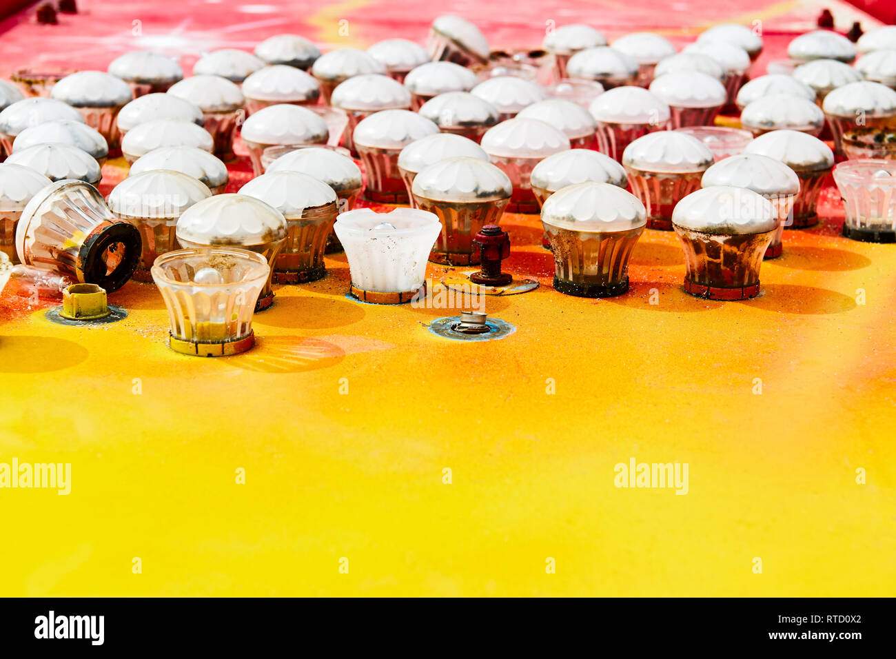 Close-up of a group of white plastic LED light bulbs, partially broken ...