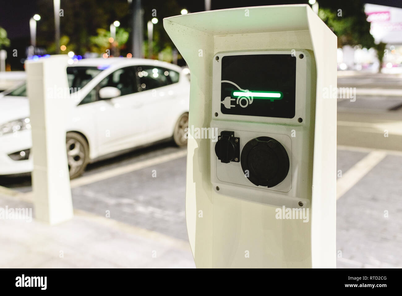 Public post charger of electric vehicles placed in the parking lot of a ...