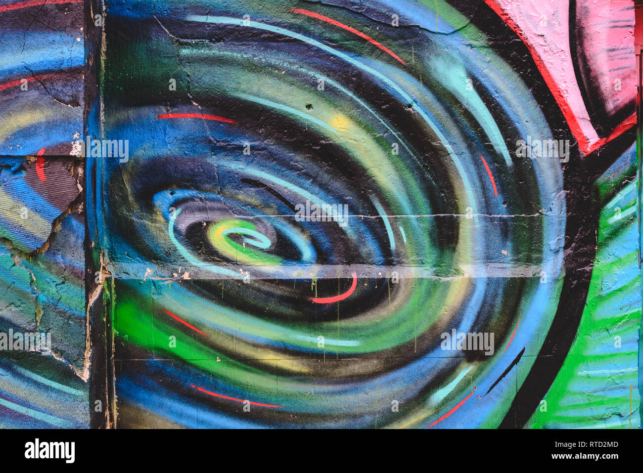 Detail of an anonymous street graffiti with many colors, cheerful urban ...