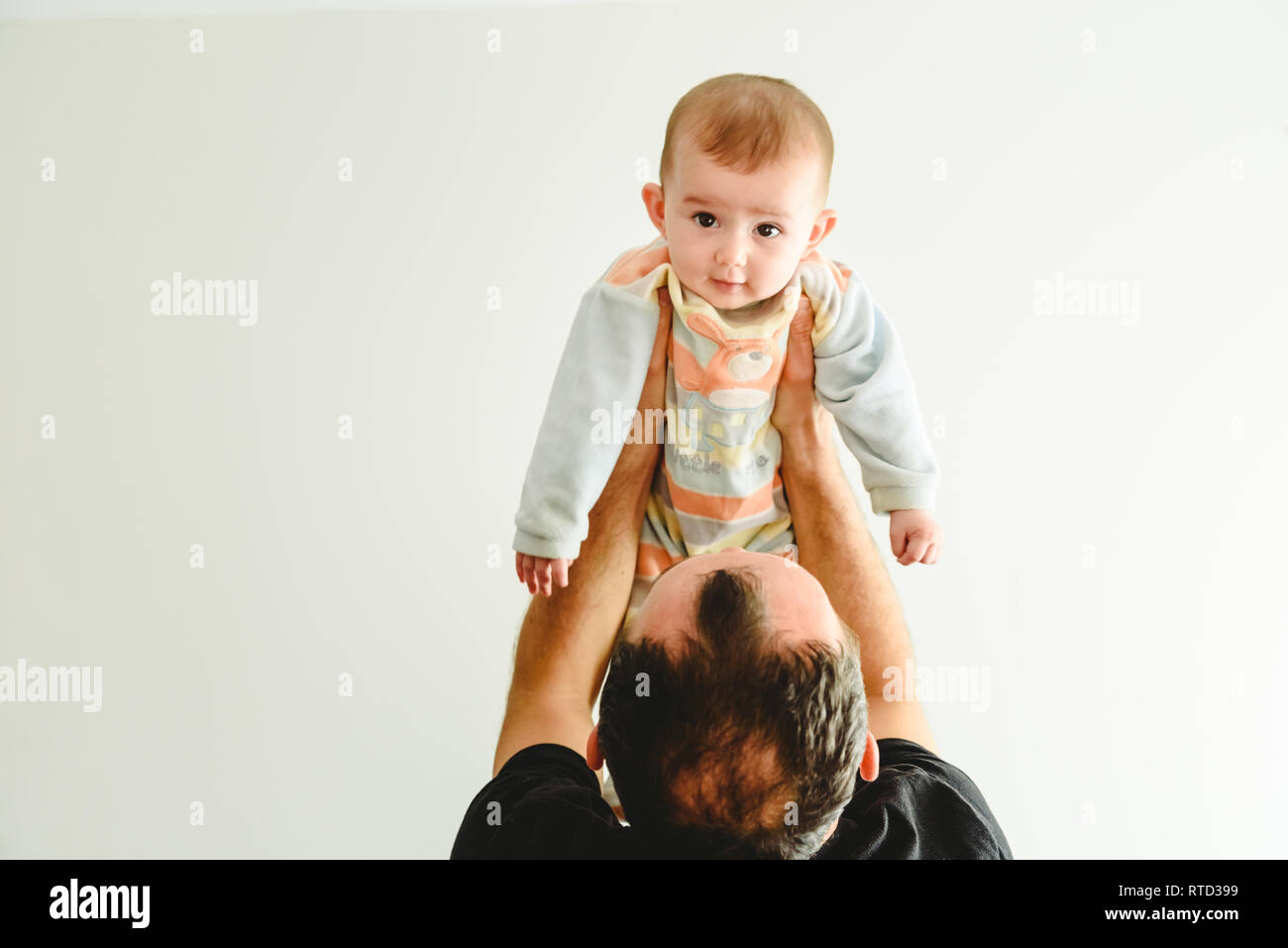 Baby raised by his father Stock Photo - Alamy