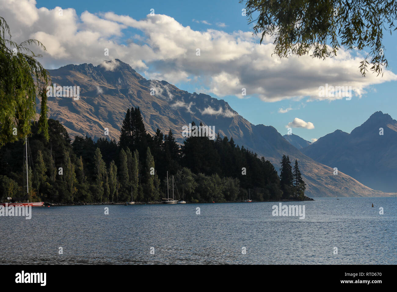 Clouds over Cecil Peak with Queenstown Gardens and Lake Wakatipu in the ...