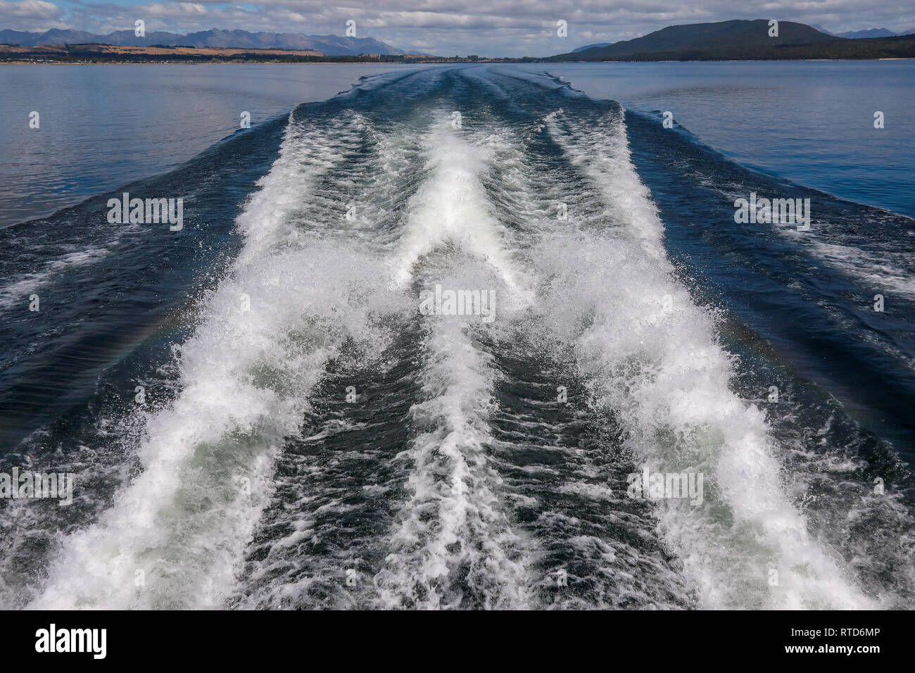 Catamaran wake pattern at full speed on Lake Te Anau, Southlands, New ...