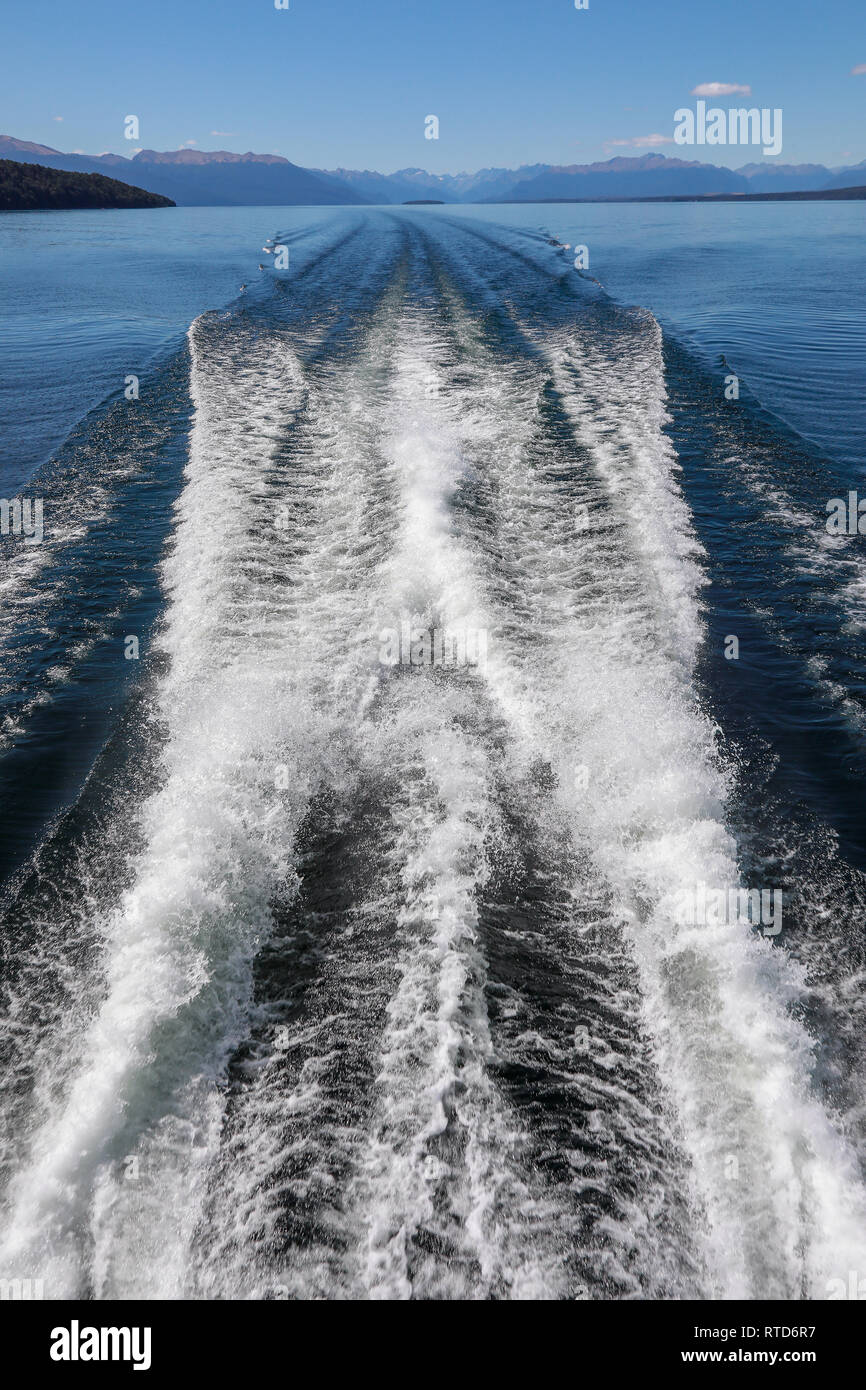 Catamaran wake pattern at full speed on Lake Te Anau, Southlands, New ...