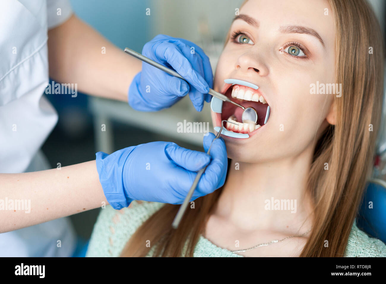 Dentist examining a patient's teeth. Dental clinic Stock Photo - Alamy