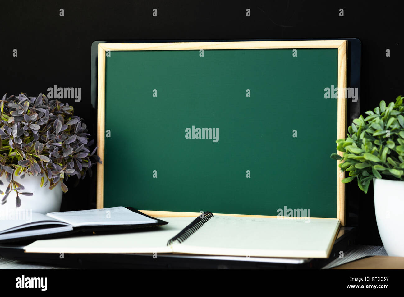 Back to school and education concept idea, green chalkboard with pile ...