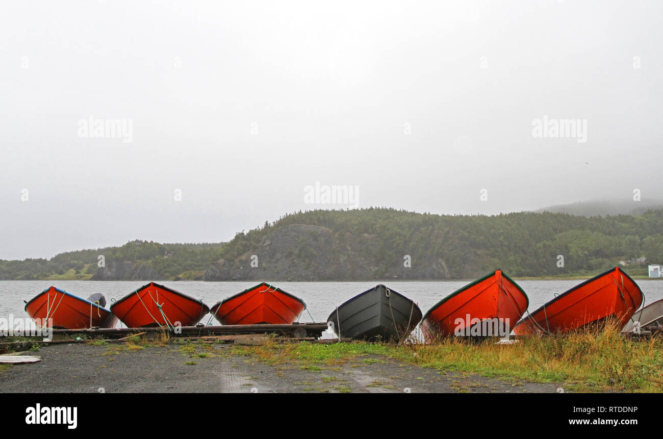 Scenic view of boats sitting on ramps on sea shore Stock Photo - Alamy