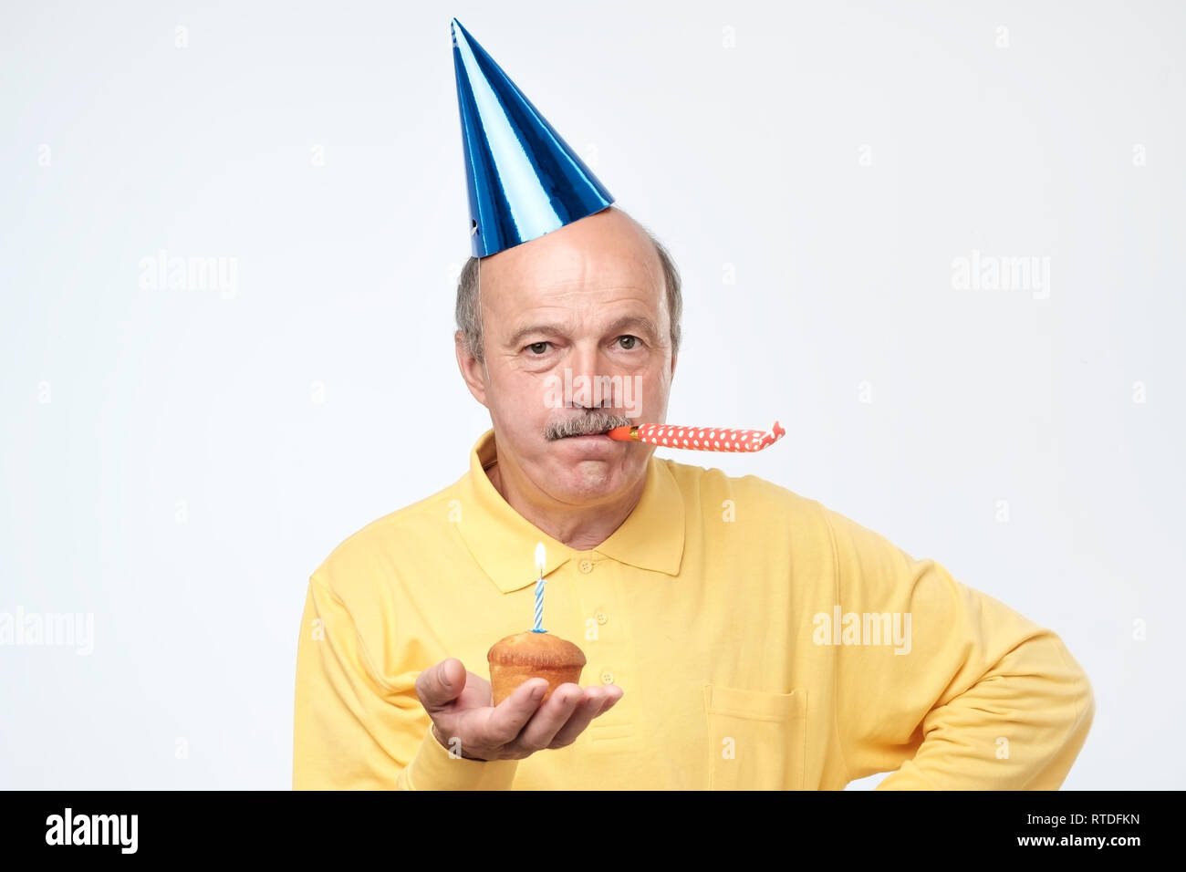 Human facial expressions. Sad father wearing cone hat and shirt looking ...